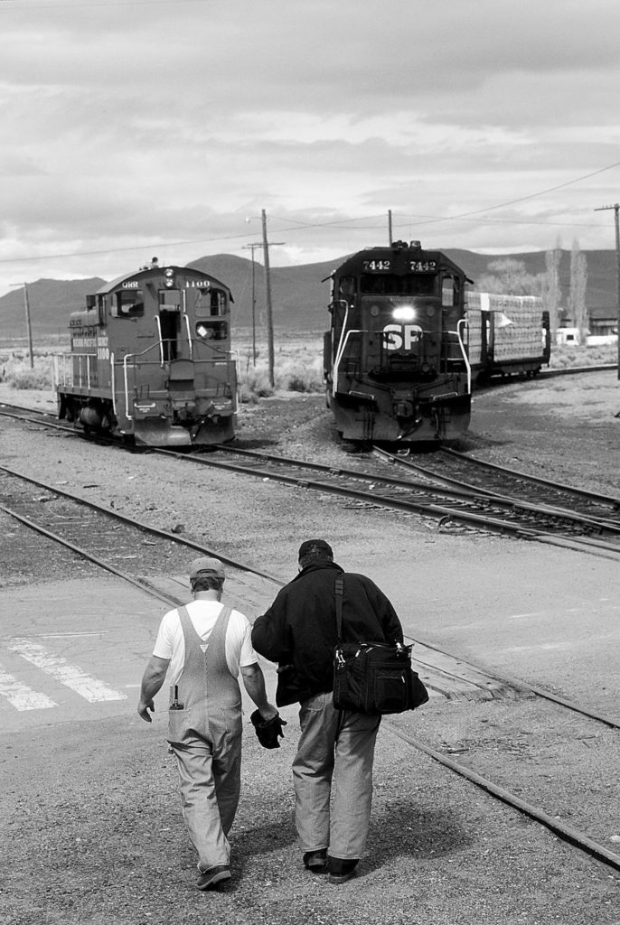 Two trains with two men walking toward them – Carlin Historical Society
